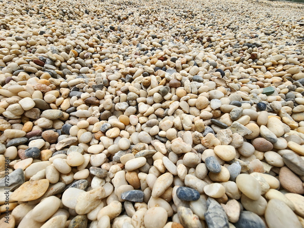 Picture of many pebble stones on the floor. Pebbles are popularly used ...