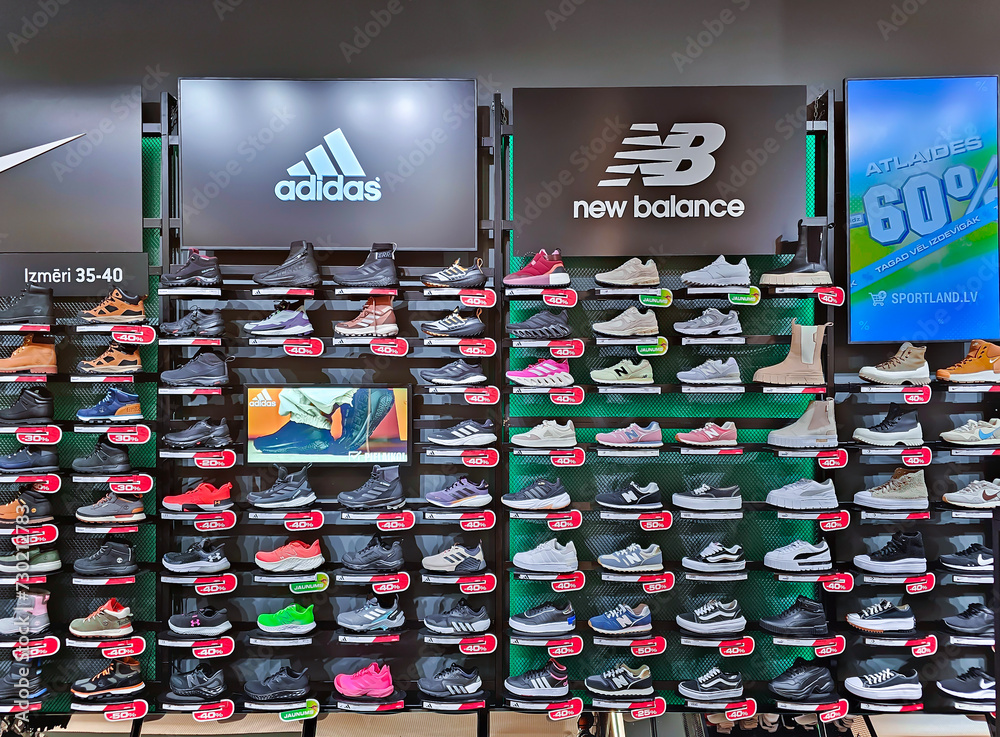 LATVIA, RIGA, 15, JANUARY, 2024: Shelves of sneakers from famous sports ...