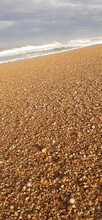 Ocean Rocks In Damp Sand Free Stock Photo - Public Domain Pictures