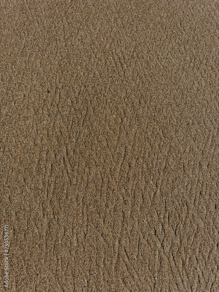 Texture of the sand on a beach in San Francisco after the tide pulls ...