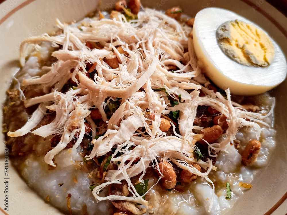 Bubur ayam or chicken congee is Chinese Indonesian rice porridge topped ...