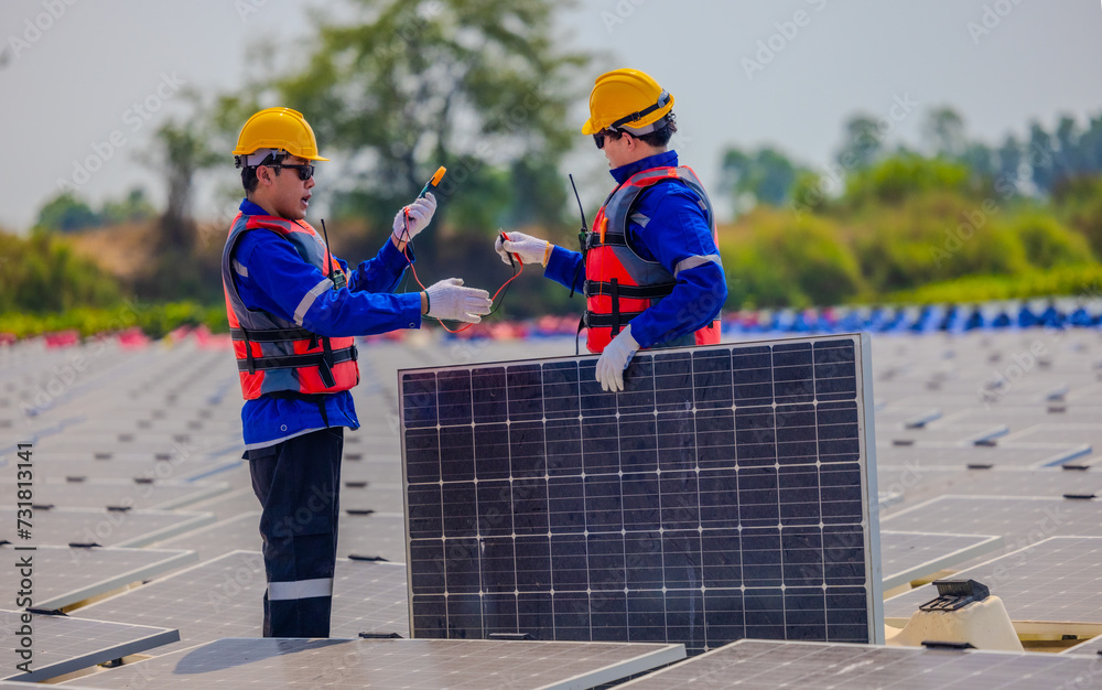 Technicians check floating solar farm wiring, polarity, and grounding ...