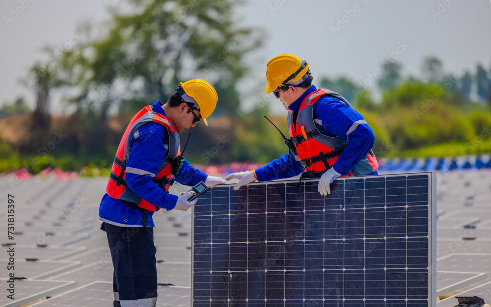 Technicians check floating solar farm wiring, polarity, and grounding ...