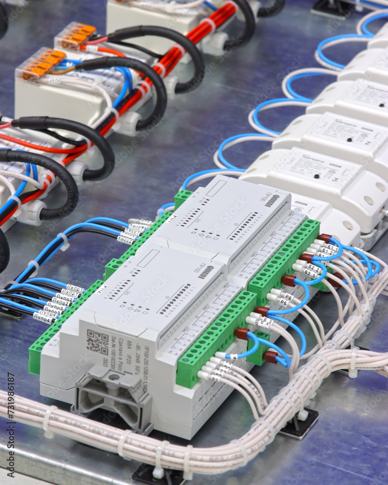 Electronic control modules for apartment automation are installed in an ...