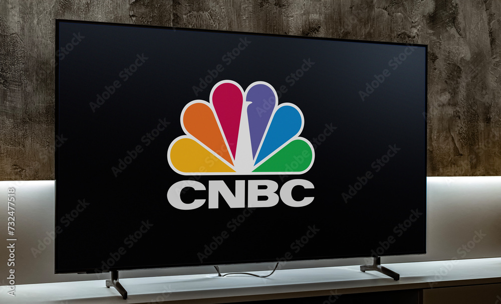 Flat-screen TV set displaying logo of CNBC Stock Photo | Adobe Stock