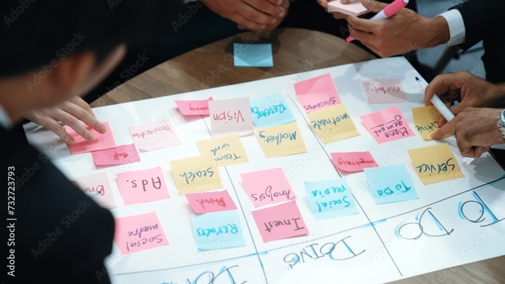 Foto de Stock Top view of business people hands making scrum task board ...