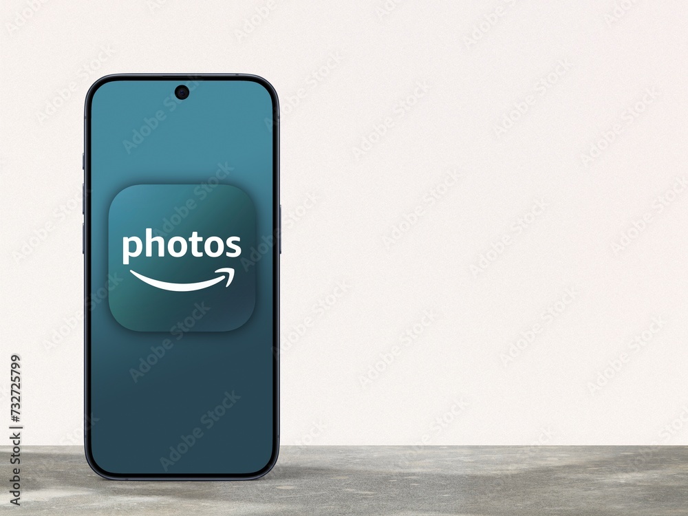 Amazon photos App logo is displayed on a smartphone, white background ...
