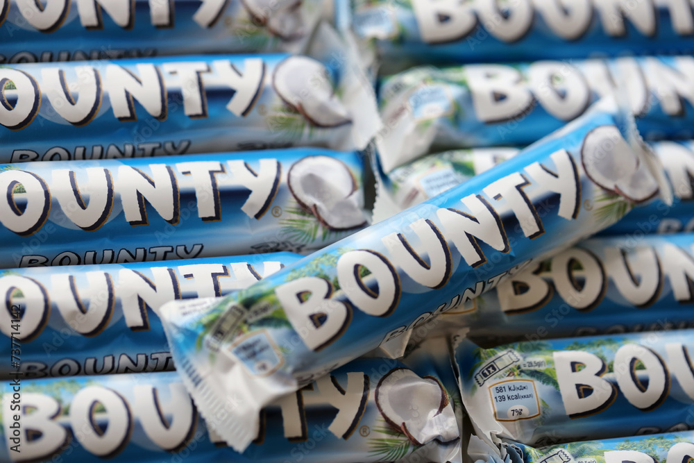 KYIV, UKRAINE - OCTOBER 31, 2023 Bounty chocolate bars with cocoa ...