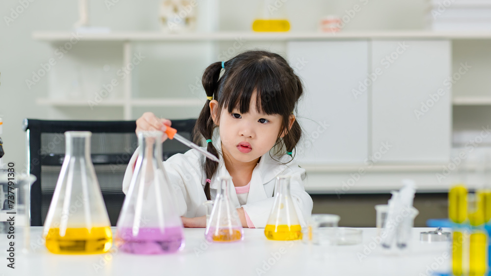 Asian little cute girl students in lab coat making test tube science ...
