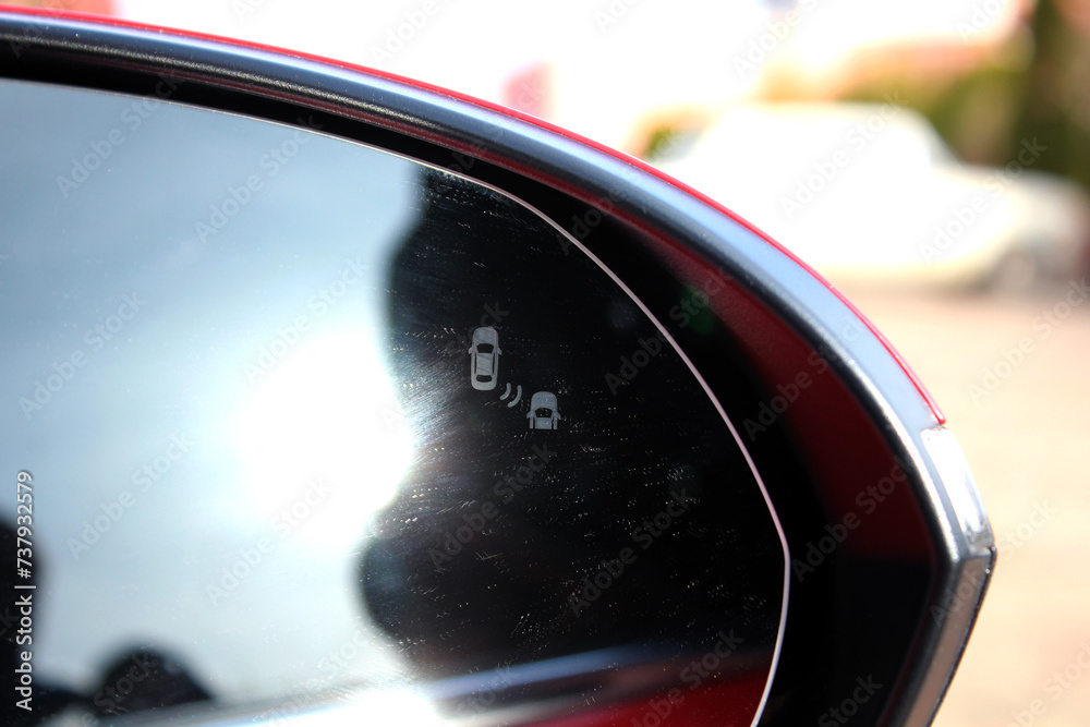 Blind zone monitoring sensor on the side mirror of a modern car. Modern ...