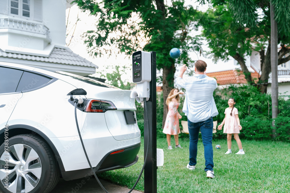Photo Stock Focus electric vehicle recharge from home charging station ...