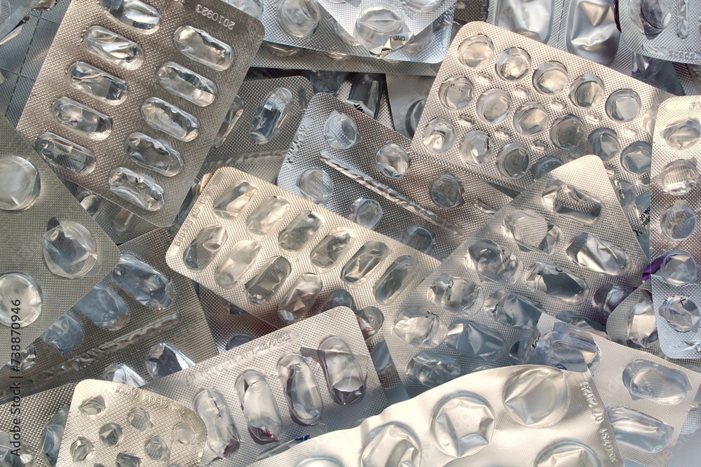 Pile of empty pill blister packs. Treatment and medication concept ...