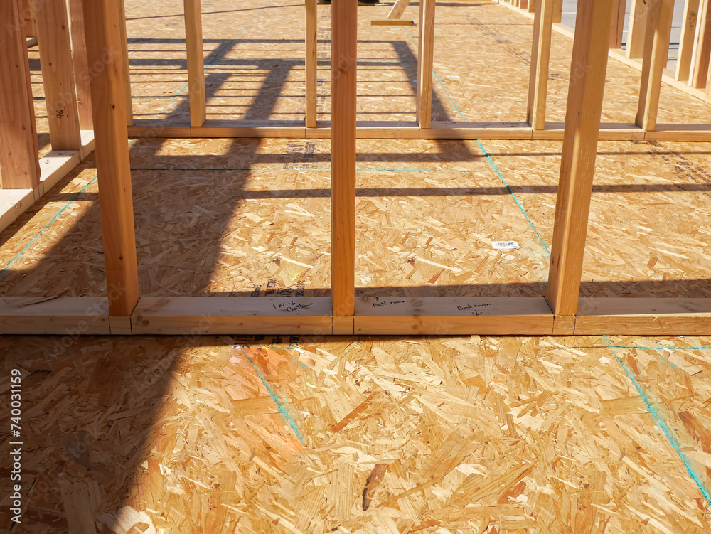OSB sub flooring sheets cover, attach to the joists with wood screws ...