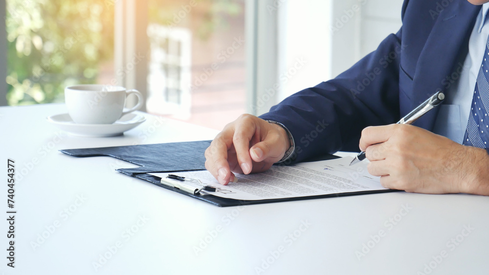 Businessman hand using pen signing on new contract starting projects in ...