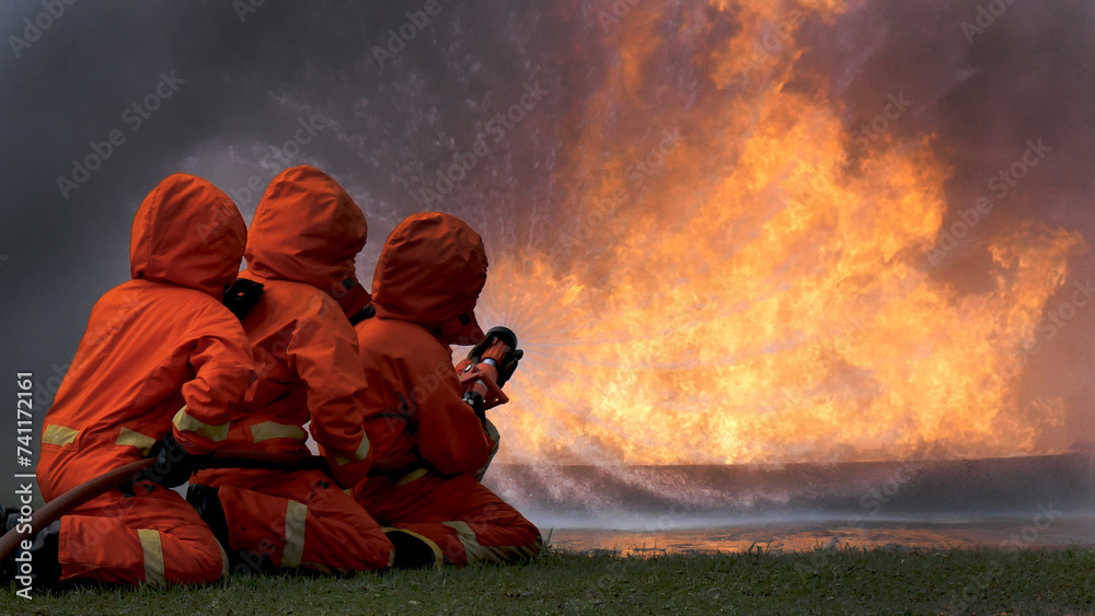 Firefighter Rescue team training in fire fighting extinguisher ...