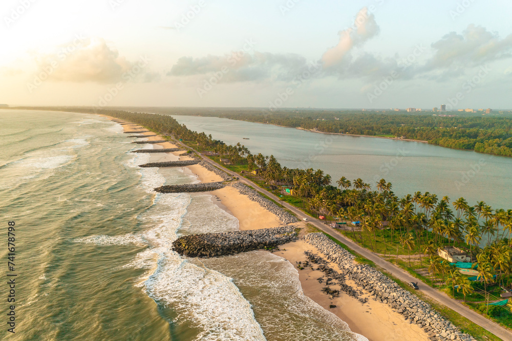 Aerial view of breakwater along a strip of land with Pithrody beach and ...