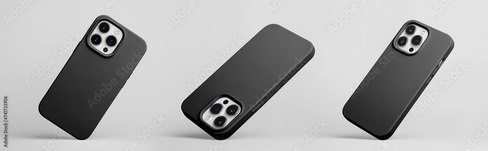 set of three iPhone 15 and 14 Pro max in black silicone case falling ...