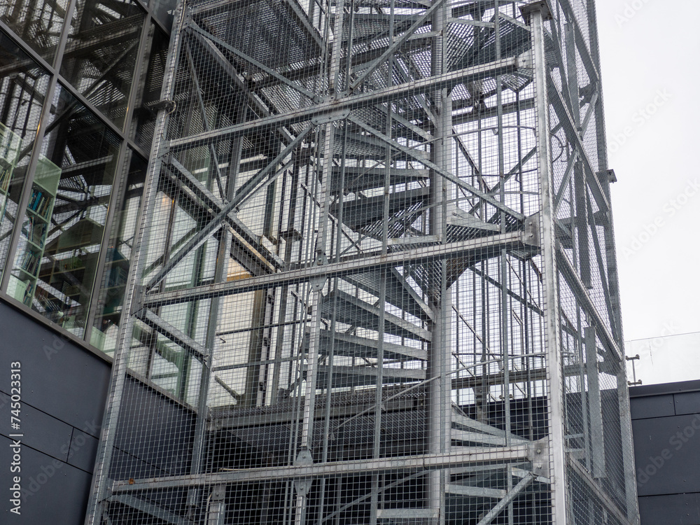 Transparent emergency staircase cladding made with wire mesh. External ...