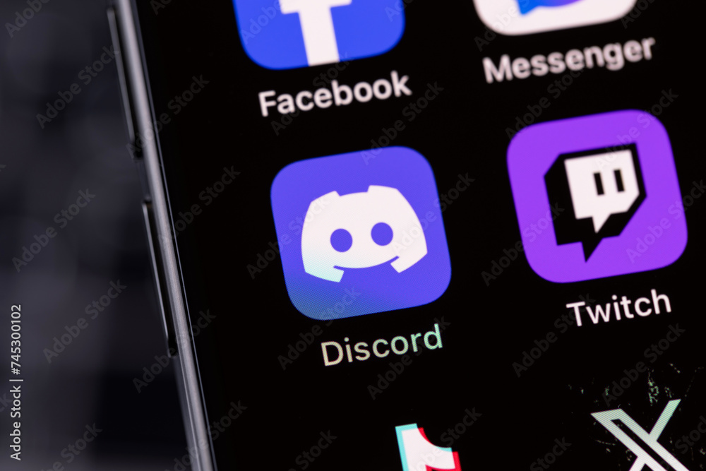 Discord mobile app on a screen smartphone iPhone closeup. Discord is a ...