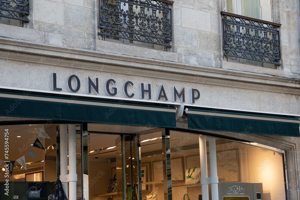 longchamp logo brand and sign text front of facade entrance store ...