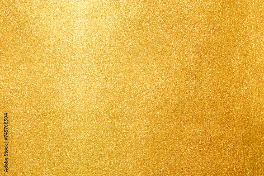 Gold wall texture background. Yellow shiny gold paint on wall surface ...