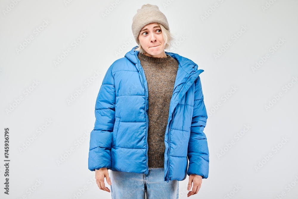 Portrait of girl with sad face offended and crying on white background ...