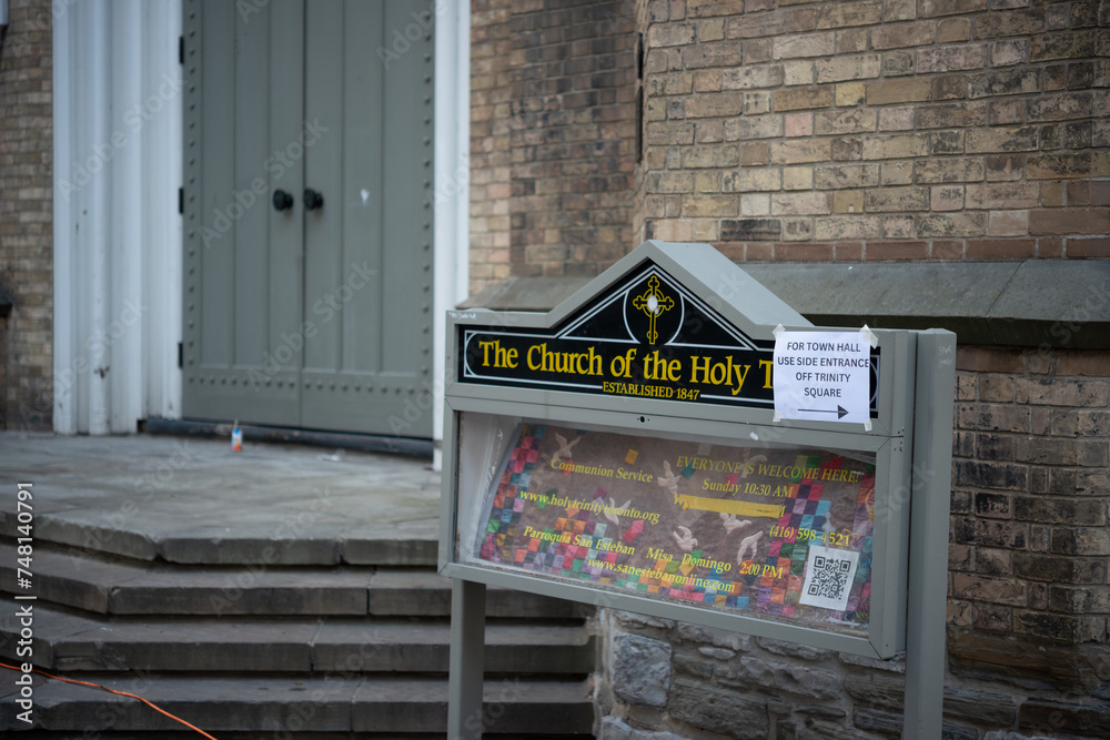 shallow depth of field focus on Church of the Holy Trinity sign located ...
