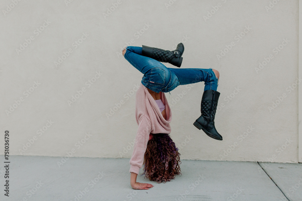 Tween girl does handstand Stock Photo | Adobe Stock