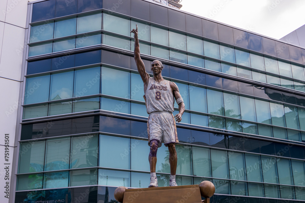 A bronze statue of the LA Lakers basketball player Kobe Bryant in front ...