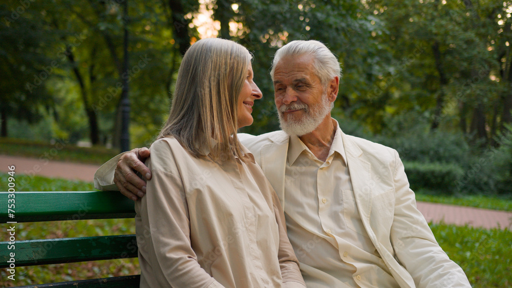 Lovely senior elderly happy Caucasian couple woman man embracing cuddle ...