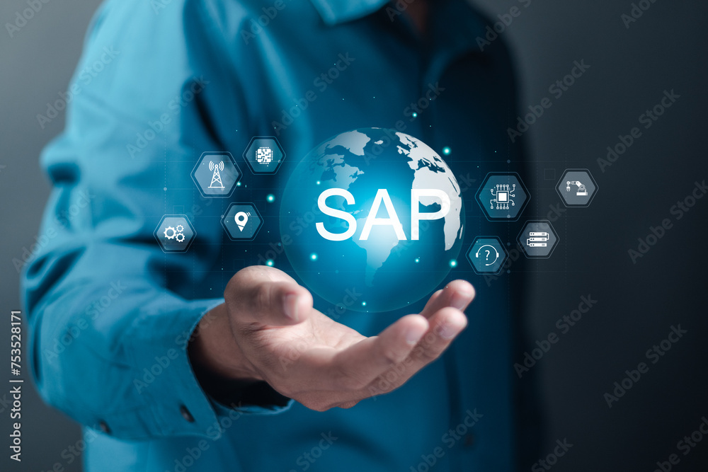 SAP, ERP enterprise resources planning system concept. Person holding ...