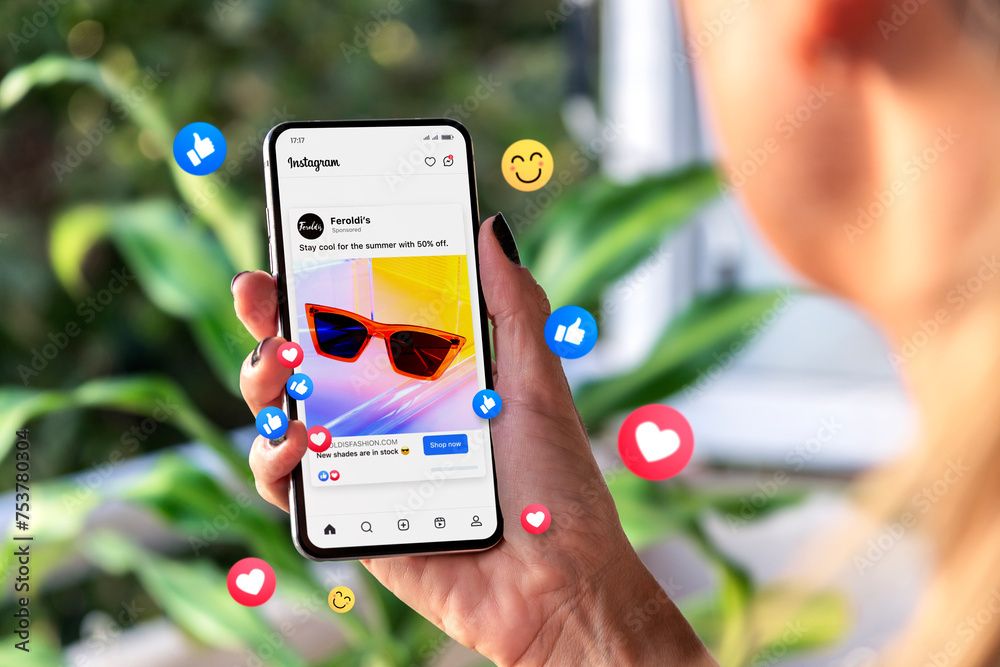 Meta ads on mobile phone screen. Woman holding smartphone showing ...