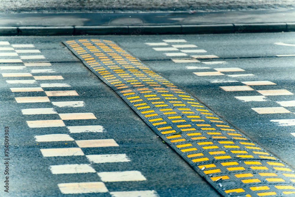 Long and wide speed bump on the road with markings Stock Photo | Adobe ...