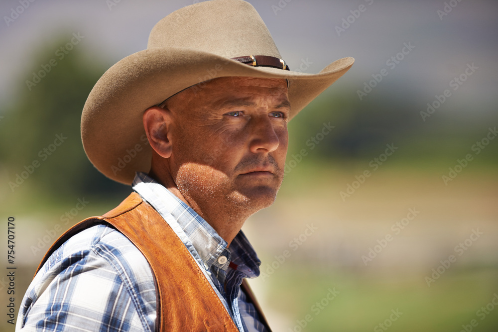 Cowboy, ranch and thinking in outdoor, sun and serious for wrangler and ...