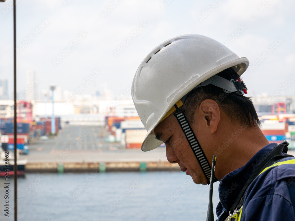 Seaman crew member of cargo vessel equipped with personal protective ...