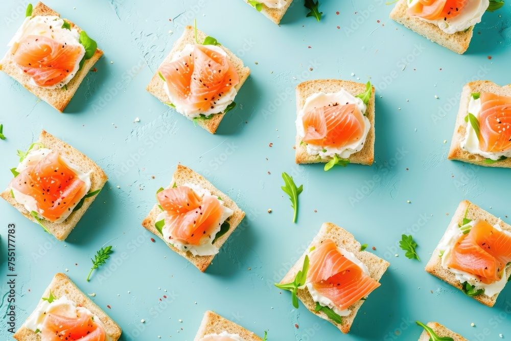 Sandwiches with salmon and cream cheese on light blue background, flat ...