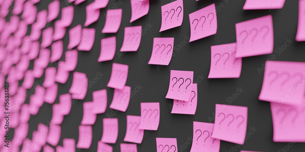 Many pink stickers on black board background with three question marks ...