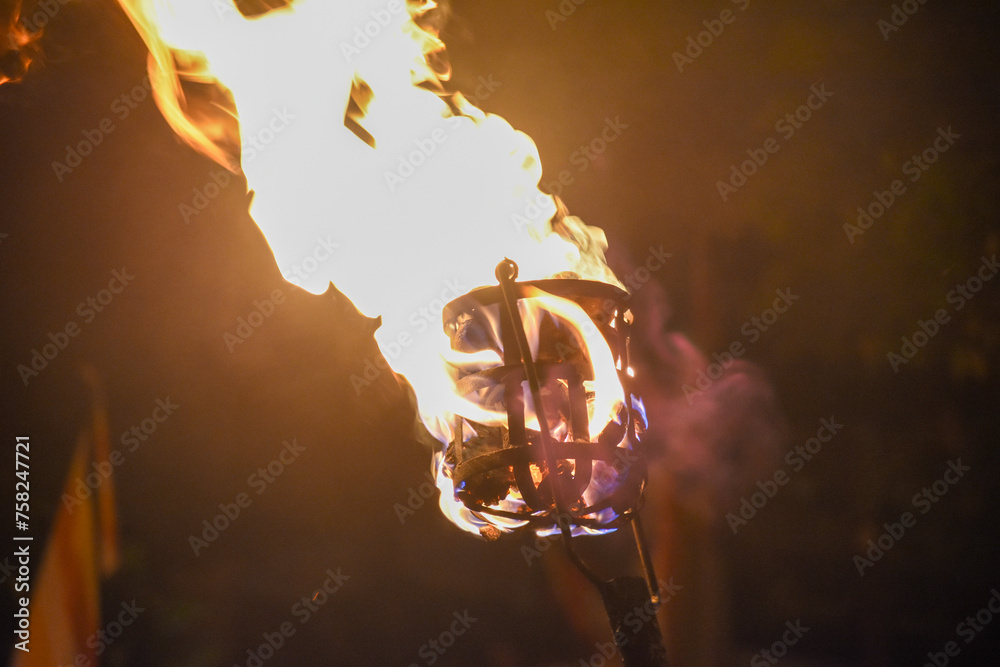Flames of a coppara torch that lighting in Kandy Esala Perahera at ...