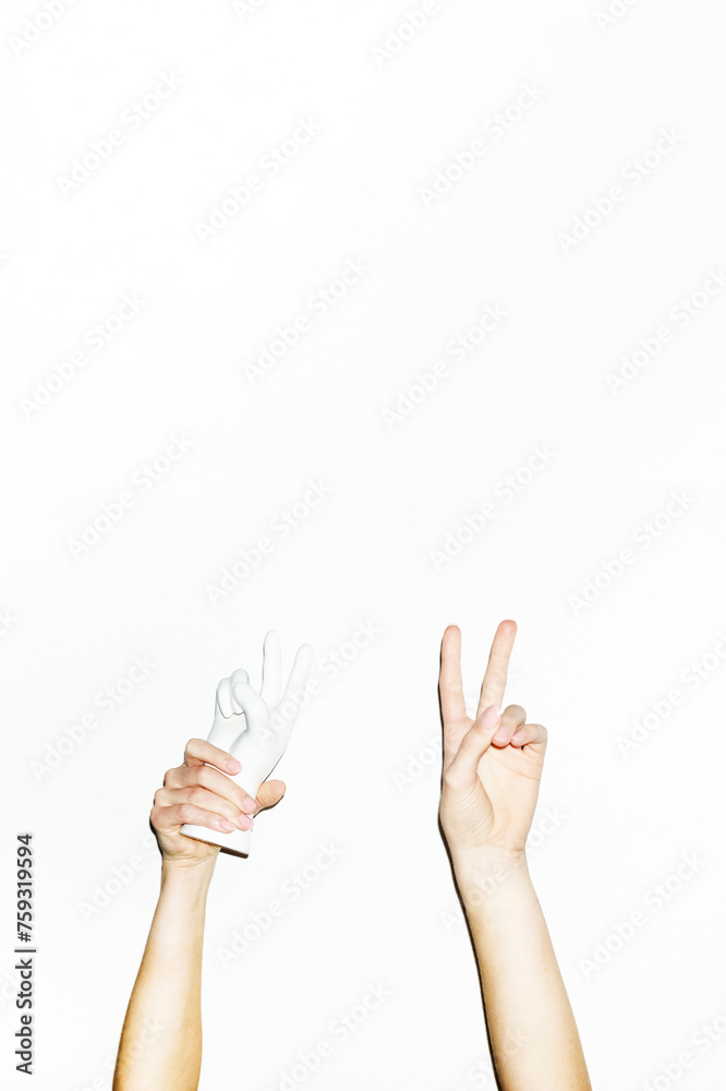 Authentic photo of hand and porcelain statue showing peace signs Stock ...