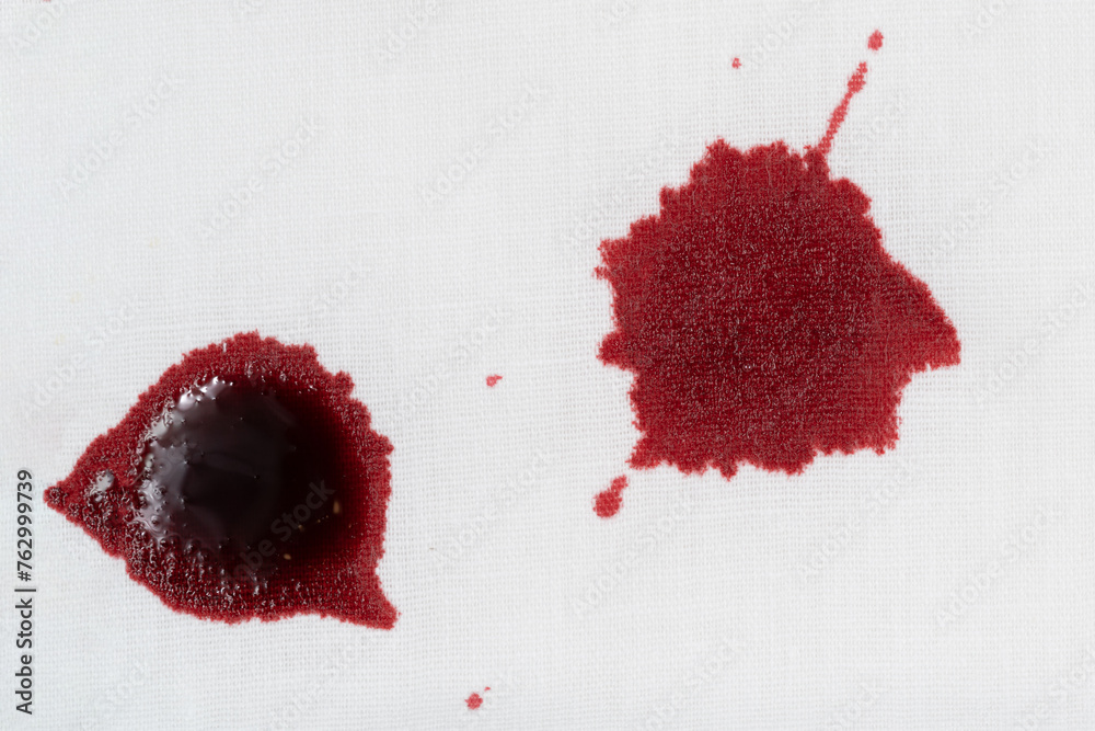 Drops of blood stains on white fabric. blood splatters on clothes. red ...