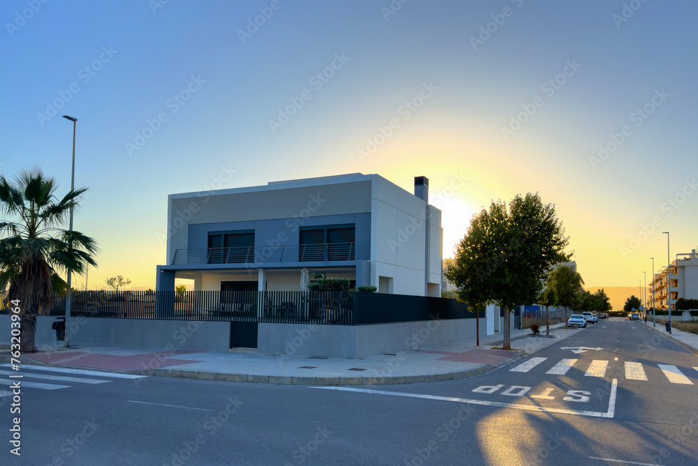 Stock-Foto „Villa on sunset. Prefabricated home on street in city ...