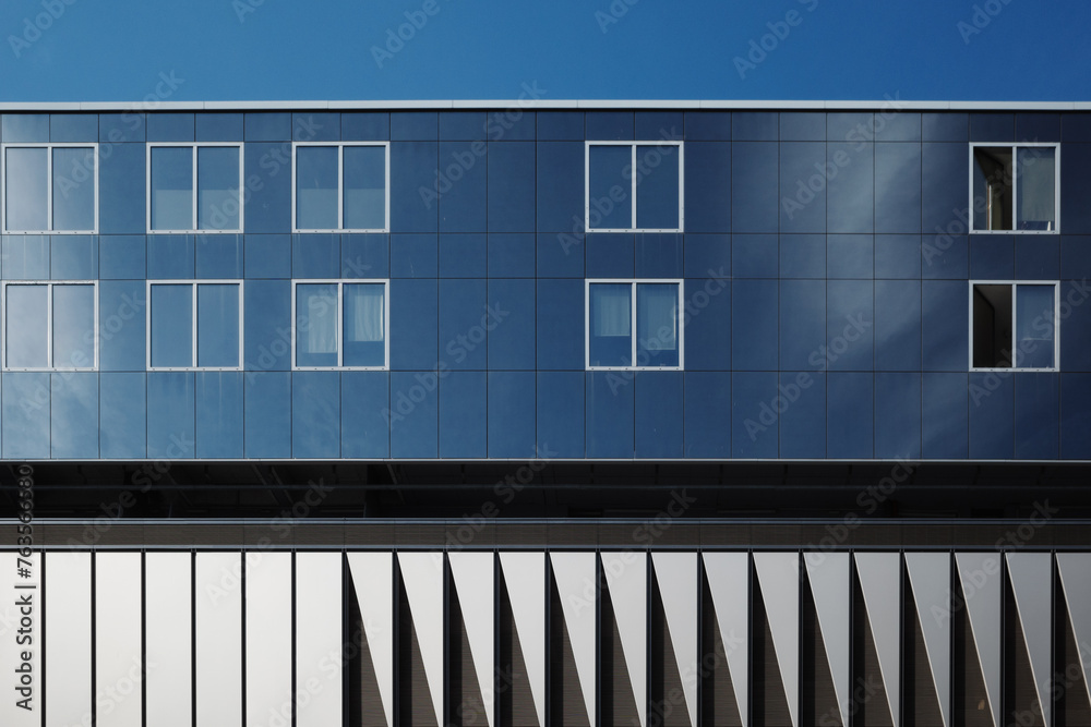 Modern architecture with its clean lines, reflective glass windows, and ...