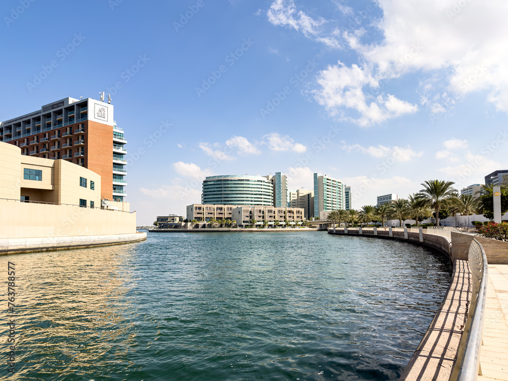 The canal and buildings in the Al Raha Beach neighbourhood in Abu Dhabi ...