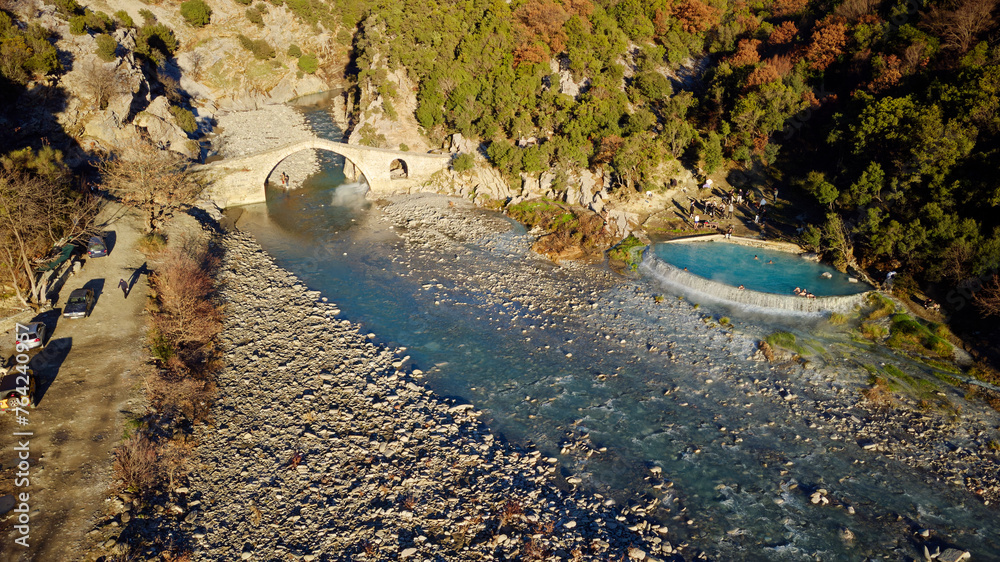 Aerial drone view of people swimming and bathing in hot springs thermal ...