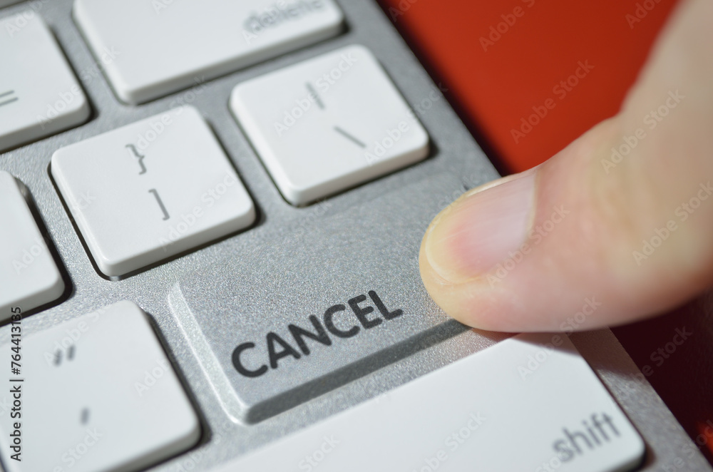 Can't cancel, illustrated by depicting the cancel key as a non ...