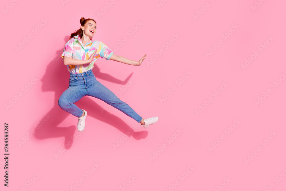 Full length body photo of rejoice young girl karate ninja jumping ...