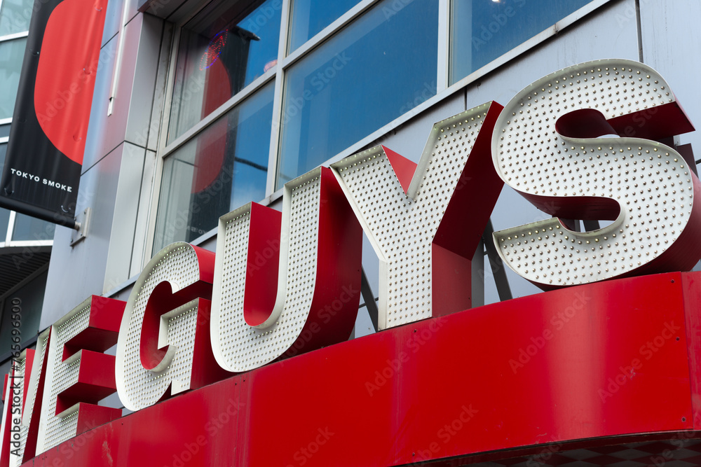 exterior building and sign of Five Guys, a fast food restaurant ...