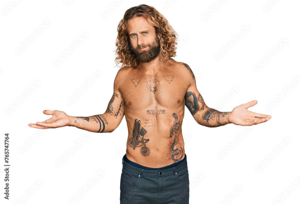 Handsome man with beard and long hair standing shirtless showing ...