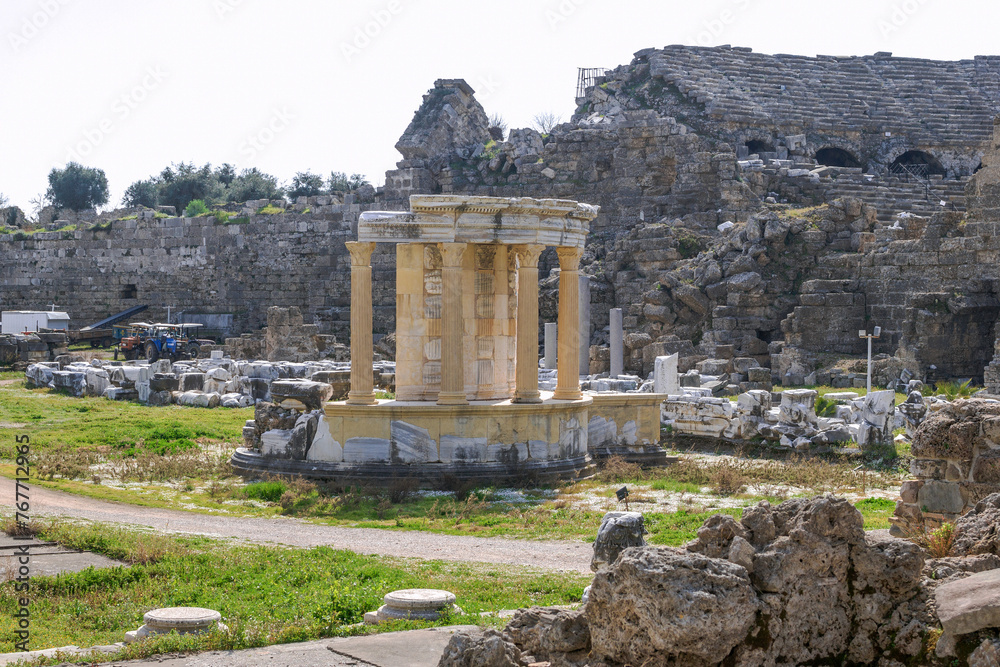 Ancient Greek temple ruins with tall stone columns and intricate ...