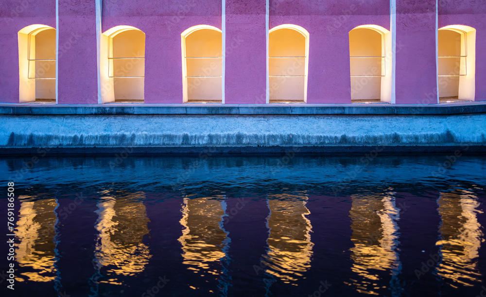 Illuminated pedestrian walkway along the Memminger Ach river in ...
